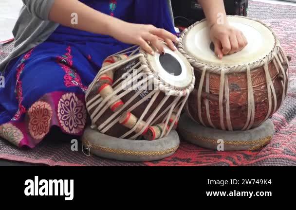 Indian woman playing Indian musical instrument Tabla Stock Video ...
