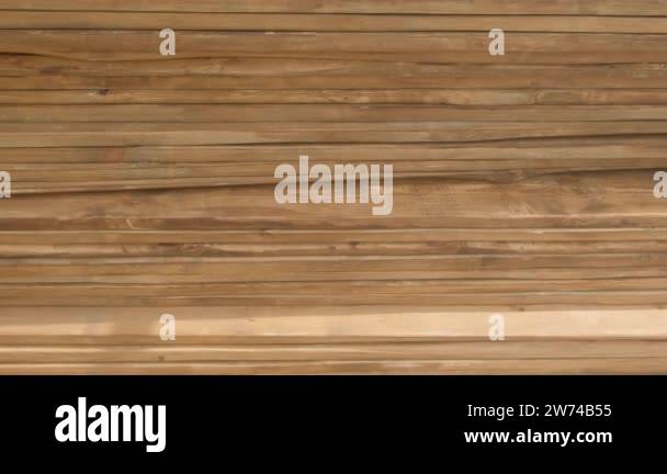 Piles of wooden planks at a sawmill, formwork. Warehouse for sawing ...