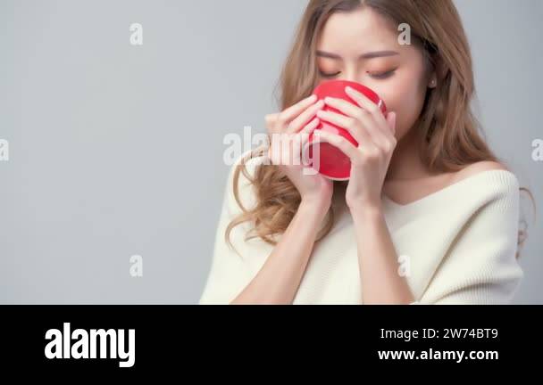 attractive asian beautiful female woman hand hold hot cup coffee drink ...