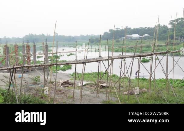 Bangladesh May 02, 2021: A primitive bamboo bridge has been built over ...