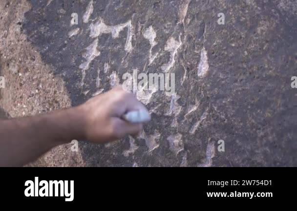 Ancient man cave painting and writing historic inscription graffiti on ...