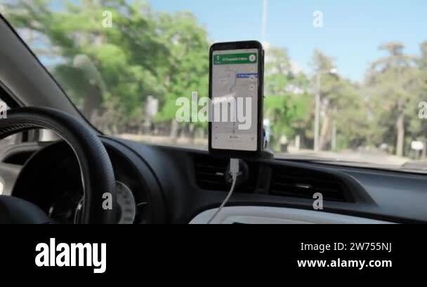 Thessaloniki, Greece - June 1, 2021: Smartphone with Google maps navigation inside moving car ...