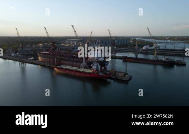 4K modern industrial port with containers from top or bird's eye view ...