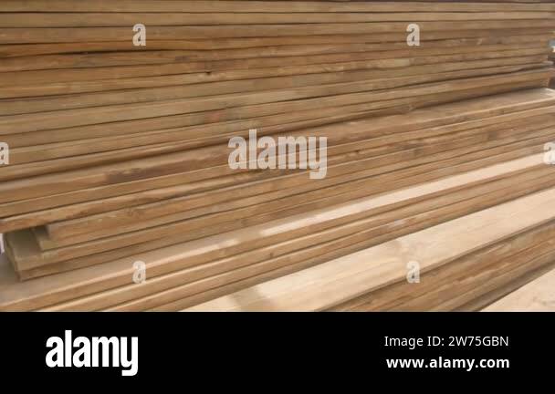 Piles of wooden planks at a sawmill, formwork. Warehouse for sawing ...