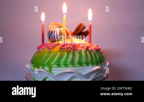 Rotating birthday cake on white background Stock Video Footage - Alamy
