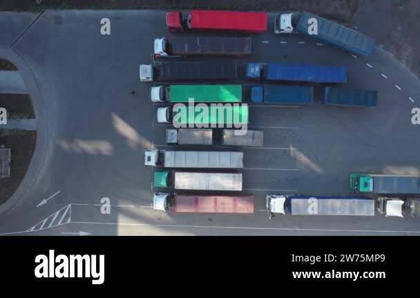 Nice top view of a lot of trucks with grain trailers waiting to unload ...