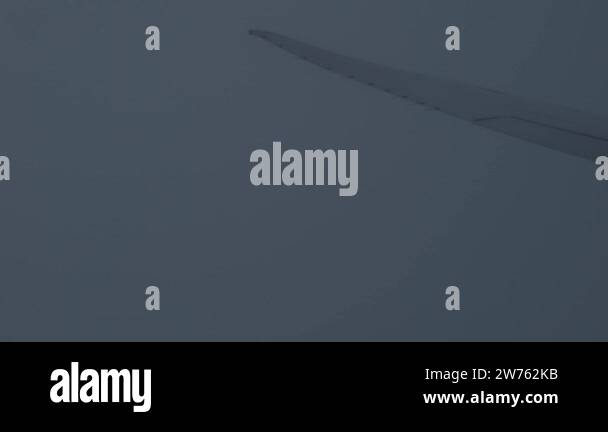 Tokyo,Japan - May 24, 2021: Aircraft wing flutter flying through clouds ...