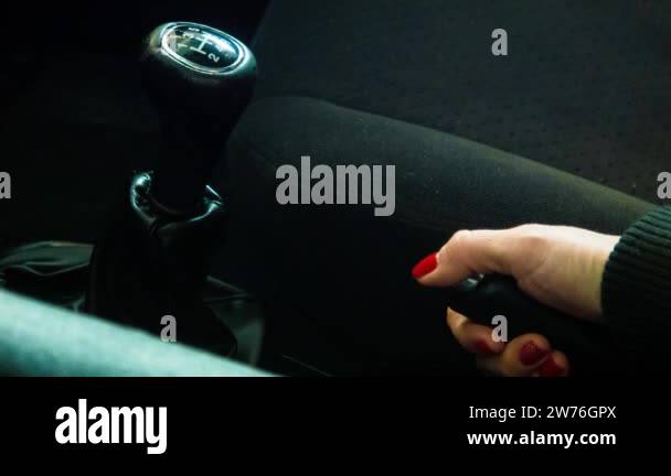The girl driver pulling the hand brake in car Stock Video Footage - Alamy