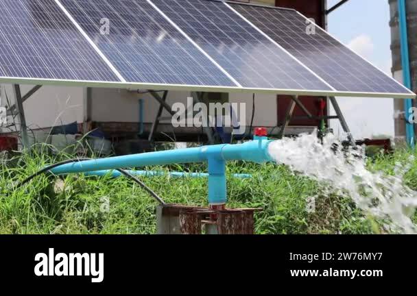 Water flows from the PVC pipe. The silver groundwater is pumped by a ...