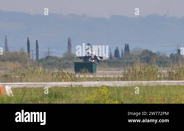 Touch down and landing of a supersonic combat jet aircraft with smoke ...
