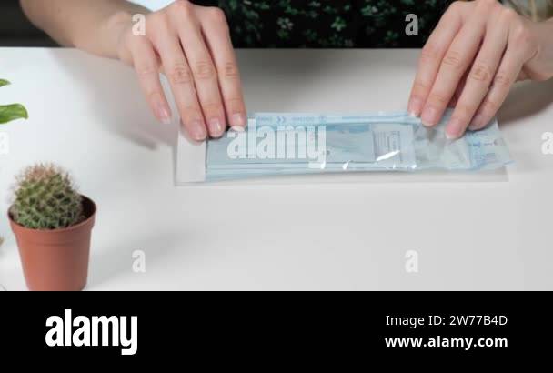 Thessaloniki, Greece - June 1, 2021: Woman holding package with Covid ...