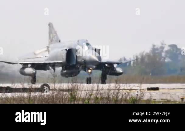 Frontal close-up view of a supersonic fighter jet interceptor take off ...