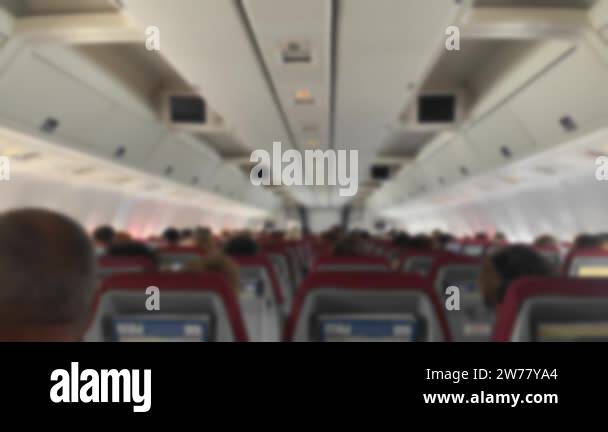defocus Back view of interior and people passengers are sitting on ...