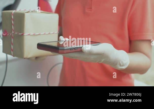 Hand of a man using QR code scanner with mobile device for a goods ...