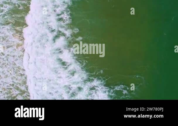 Aerial view top view Beautiful tropical beach with white wave crashing ...