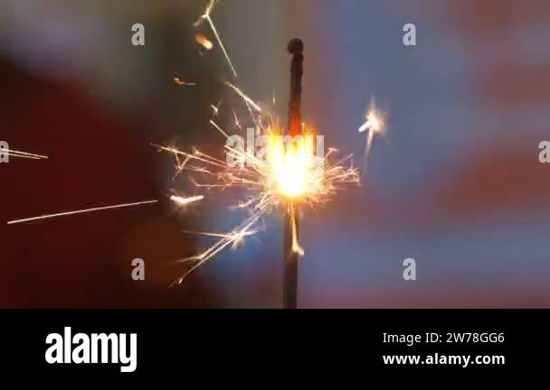 Burning bengal fire and sparks on defocused background in 4K Stock ...