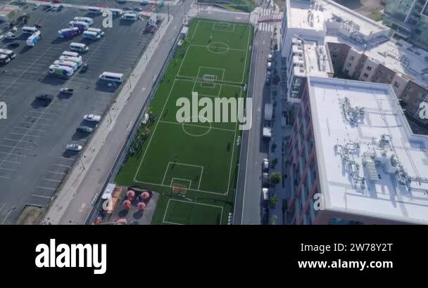 Static shot of soccer field pan down of middle of city Stock Video ...