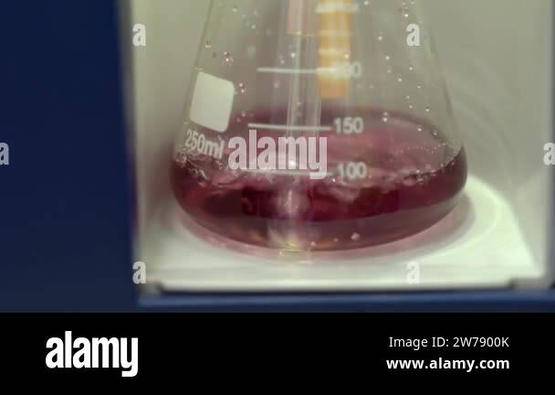The alkali poured into a glass container traps sulfuric acid vapors ...