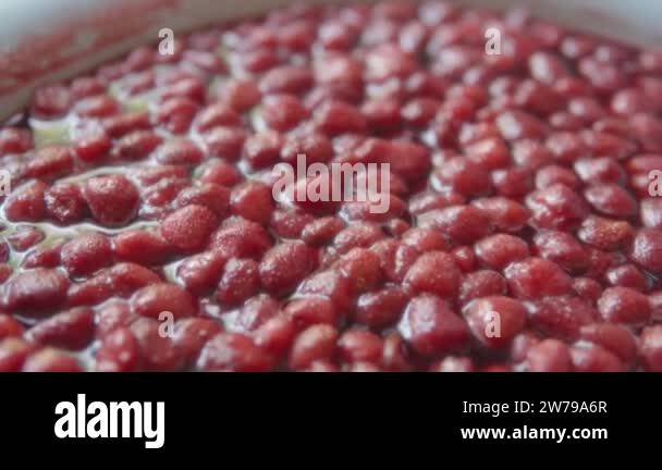 The process of making homemade strawberry jam on a gas stove Stock ...