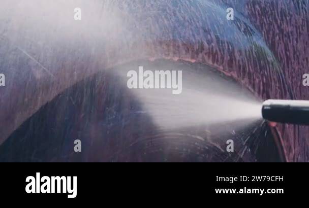 Car wash and detailing in auto service. Professional worker washing car ...