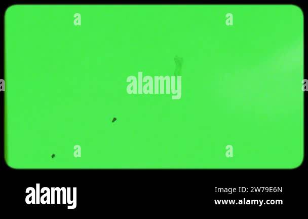 Vintage film effects. Effect of an old TV with a kinescope on a green ...