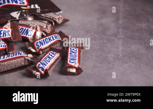 dhaka bangladesh 23th may 2021. snickers candy and packet on black ...