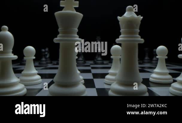 Game of chess. Filmed in a dark key. White moves with a pawn. Super ...