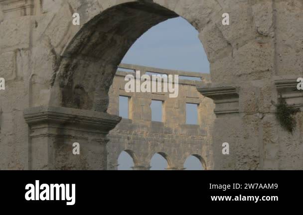 Arena wall seen through an arched window Stock Video Footage - Alamy