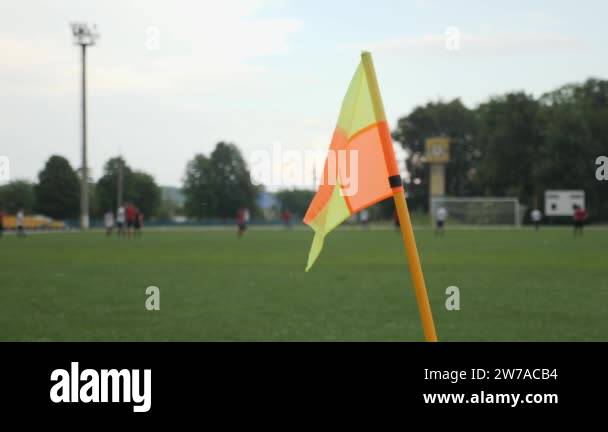 Football corner flag waving in wind on soccer field. Corner flag on ...
