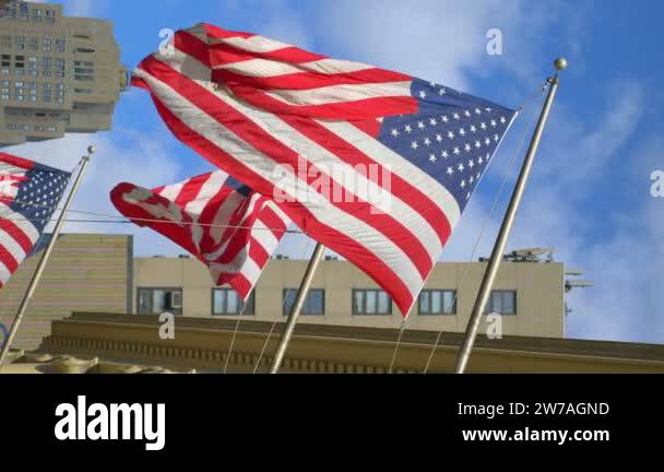 United States flag waving in New York in vertical in 4K slow motion ...