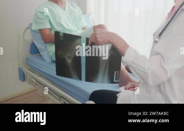 Doctor is specialist diagnosis about disease of bone leg with injured ...