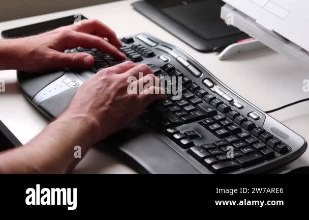 Business man or professional programmer typing on ergonomic keyboard ...