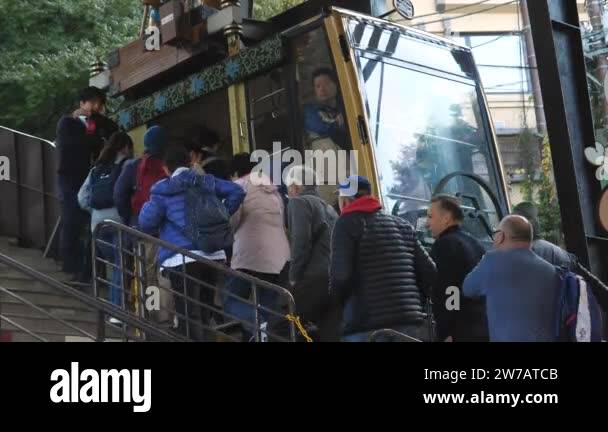 People getting inside the funicular in Kawaguchiko Tenjozan Park in ...
