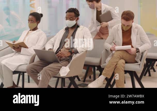 Medium shot of young female medical student being late for class ...