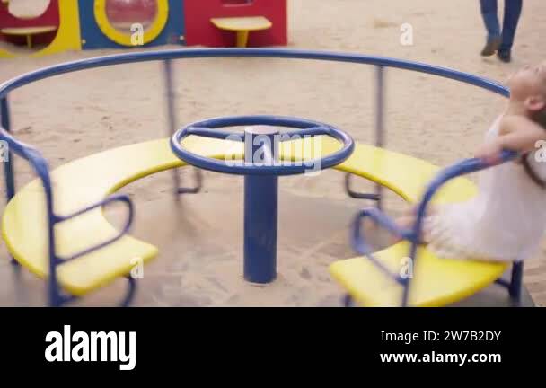 Little Girl Spinning Merry Go Round Carousel Amusement Park Playground ...