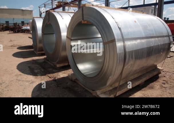 Stainless steel rolls. Rolls of steel sheet in the warehouse. A roll of ...