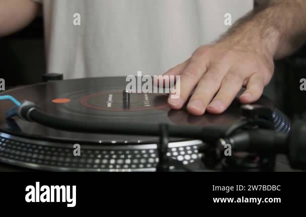 KYIV - 10 JUNE, 2021: Hand of disc jockey scratching vinyl records in ...