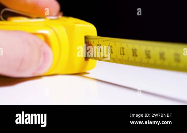 Yellow tape measure measuring Stock Videos & Footage - HD and 4K Video ...