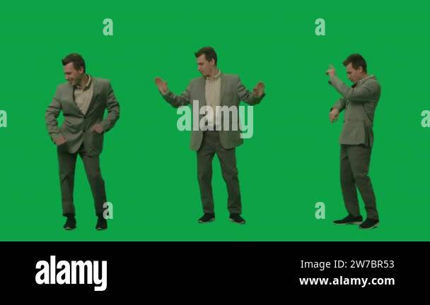 Portrait of young man in gray business suit is dancing modern dance in ...