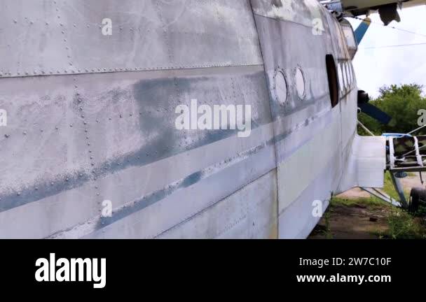 A close-up of an old wrecked passenger plane that has been ...