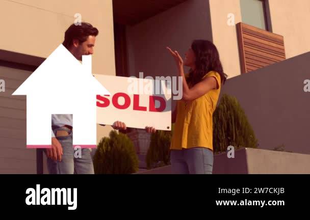 Animation of house icon filling up with pink over happy couple holding ...