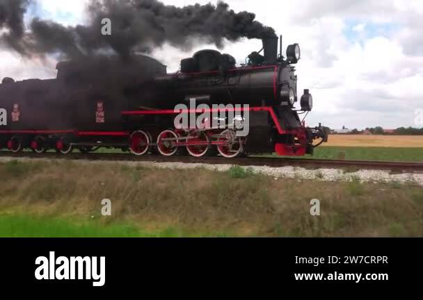 Vintage coal steam locomotive with smoke on trail. Retro transport and ...