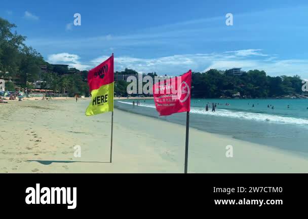 Flag with No swim and swim here message on wind at crowded but ...