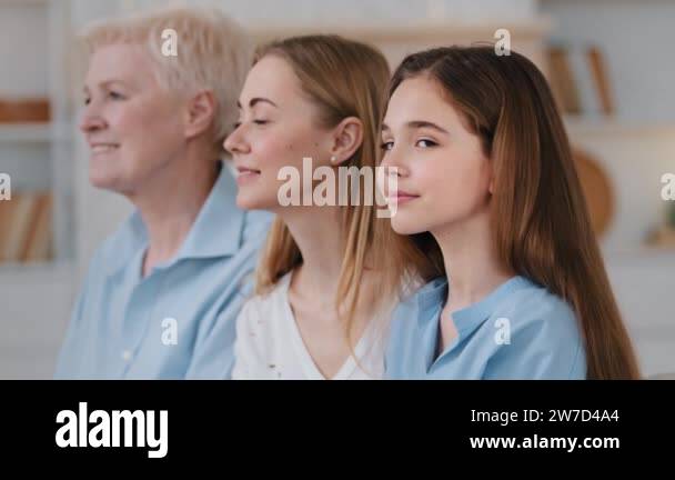 Profile faces in row three generation of women, little girl turn head ...