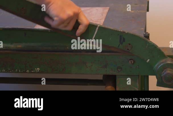 Man's Hands Cut The Copper Plate in Guillotine Installing the Copper ...