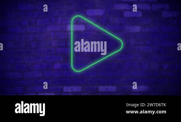 Animation of neon play button flickering with copy space over brick ...