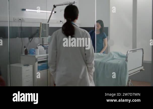 Sick child patient wearing oxygen nasal tube resting in bed recovering ...