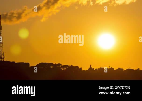 Rome at sunset timelapse with the fiery orb of the sun dropping below ...