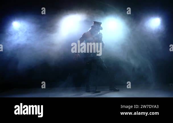 rock strip singer singing into a microphone, Slow motion, smoke Stock ...