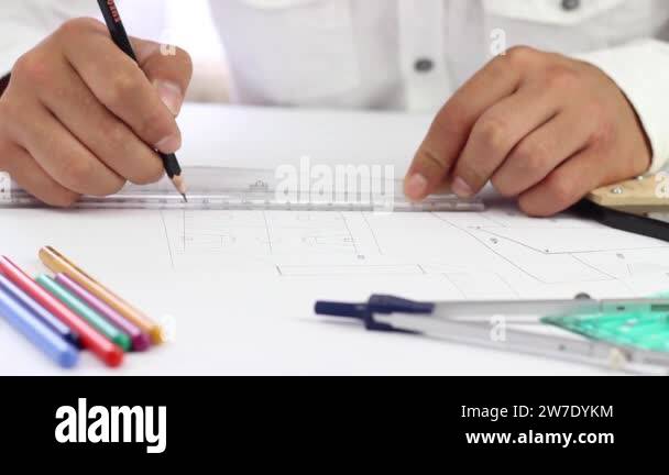 Architect hands drawing lines using ruler and pencil on the paper Stock ...